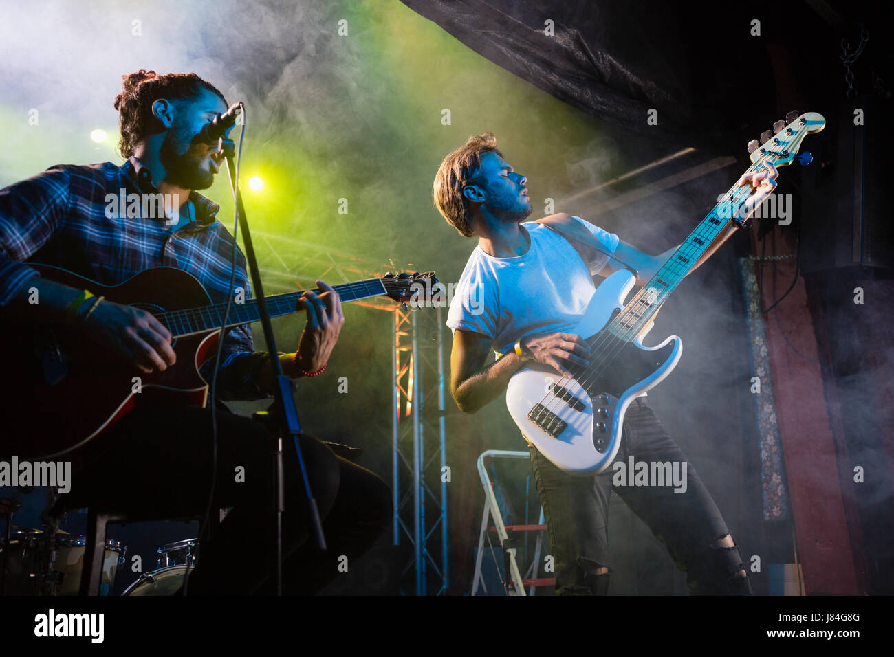 Band performing on stage in nightclub Stock Photo - Alamy