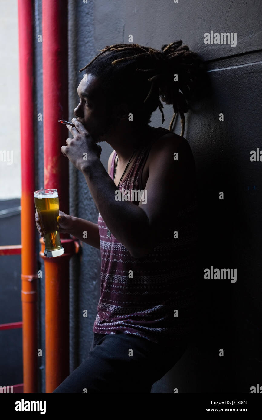 Man smoking having beer hi-res stock photography and images - Alamy