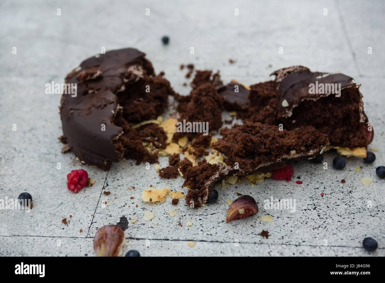 Close up of fallen chocolate cake on floor at cafe Stock Photo - Alamy