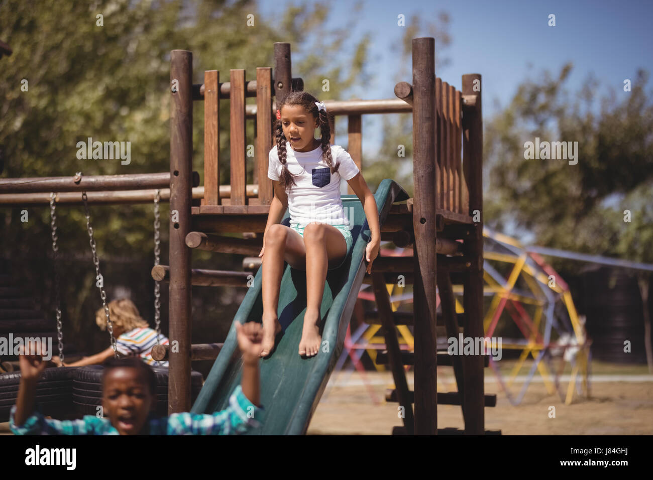 School playground swing slide hi-res stock photography and images - Alamy
