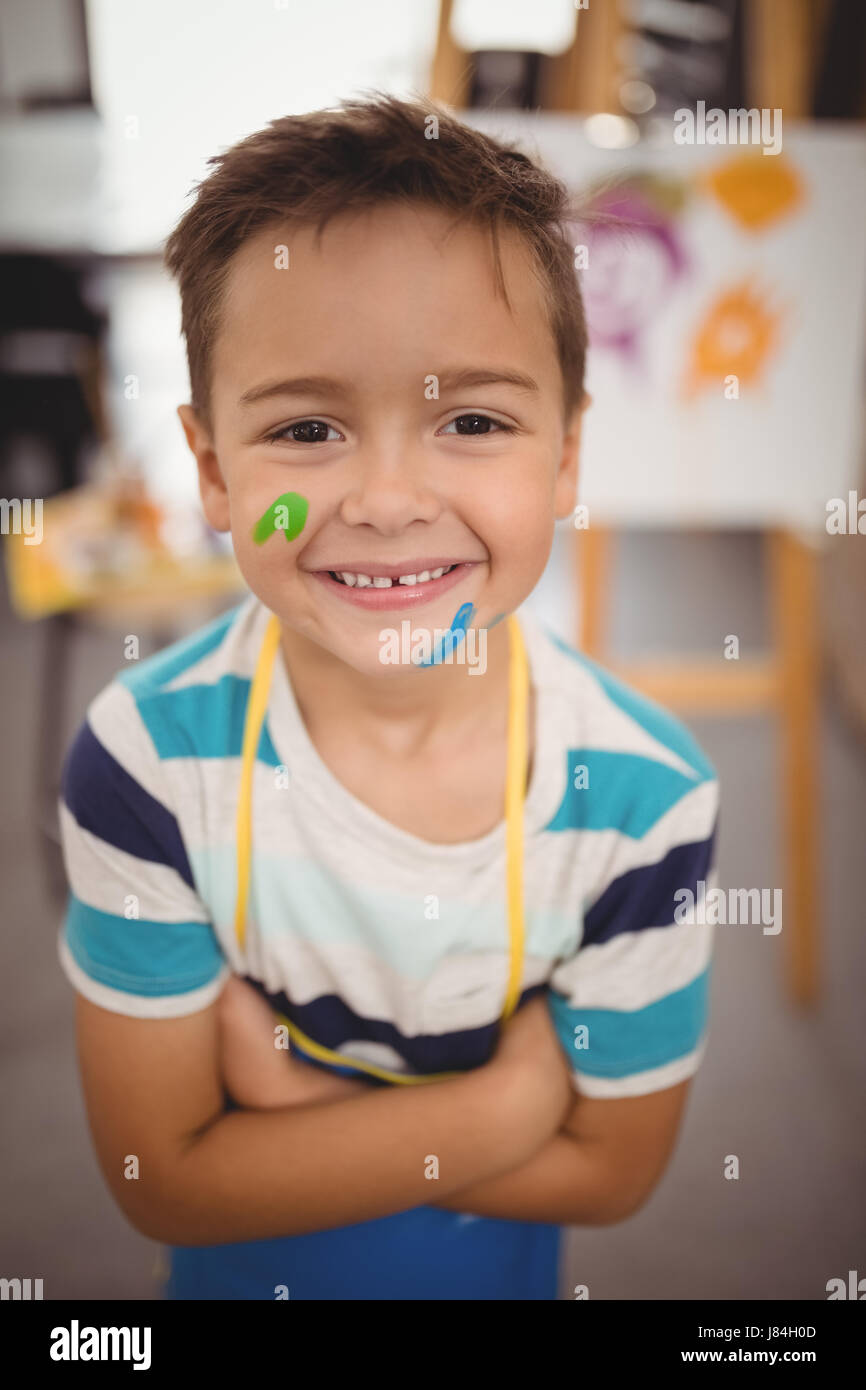 Portrait of smiling schoolboy with paint on face Stock Photo - Alamy