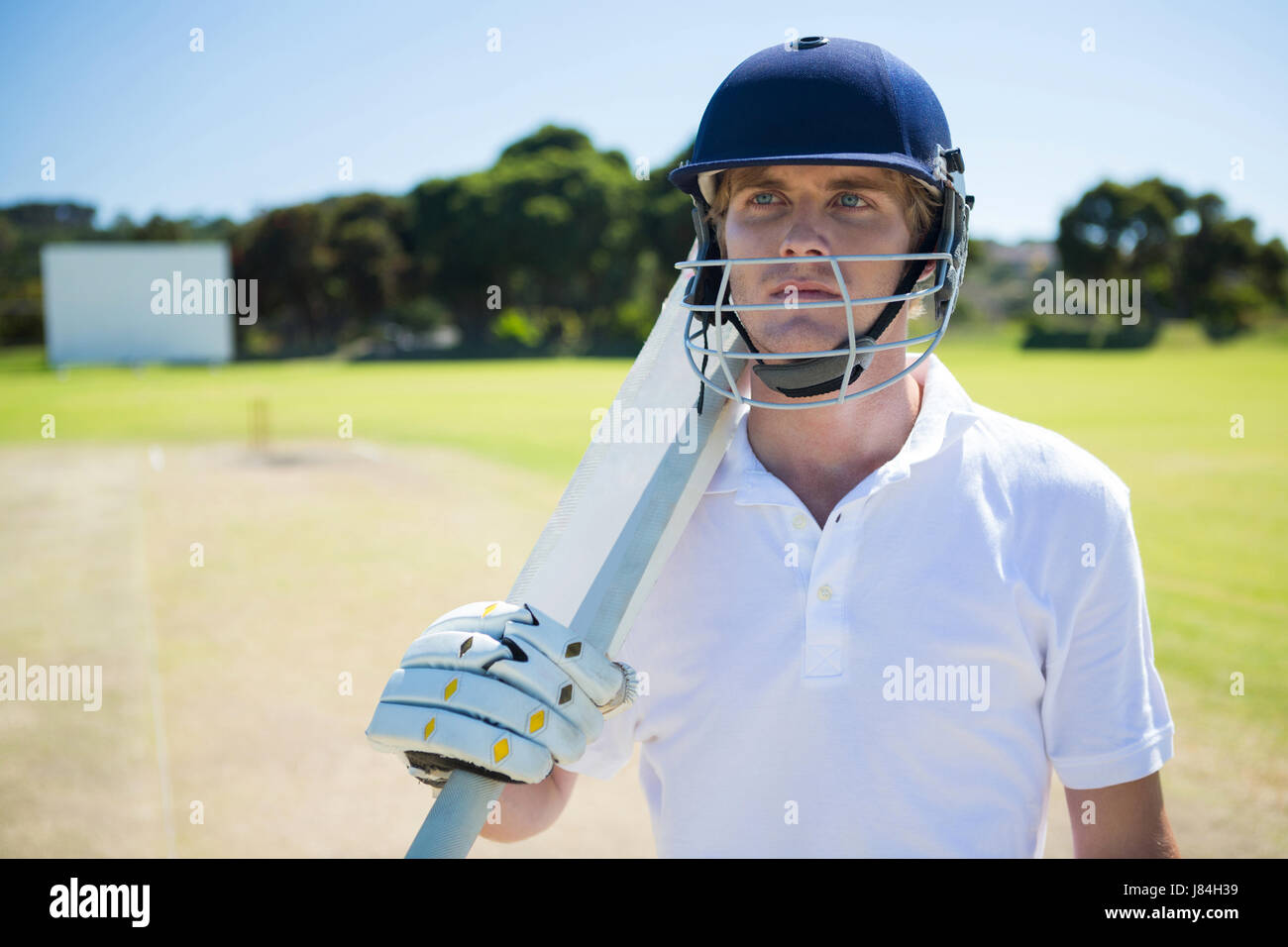 Cricket player holding cricket bat hi-res stock photography and images ...