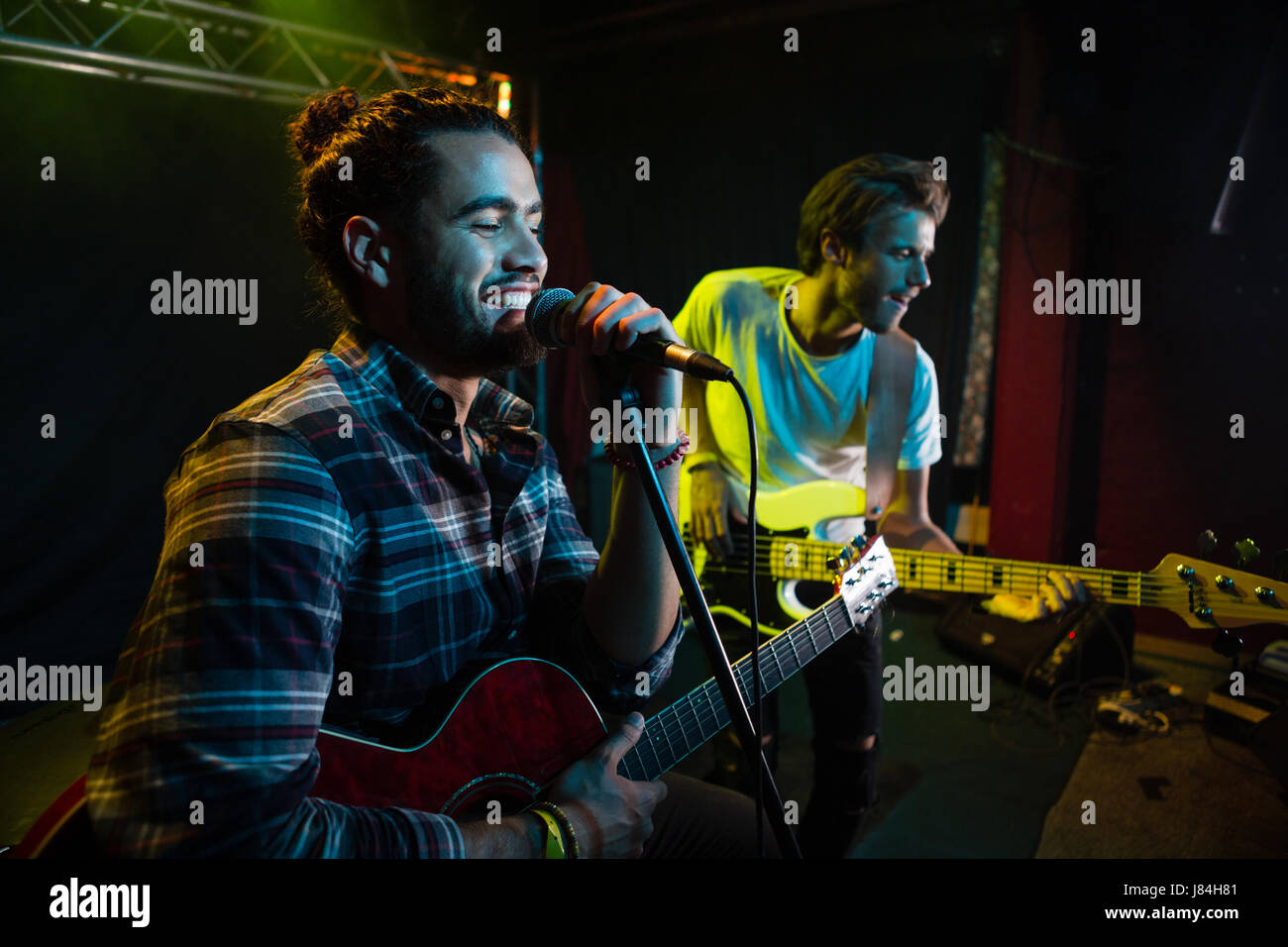 Band performing on stage in nightclub Stock Photo - Alamy
