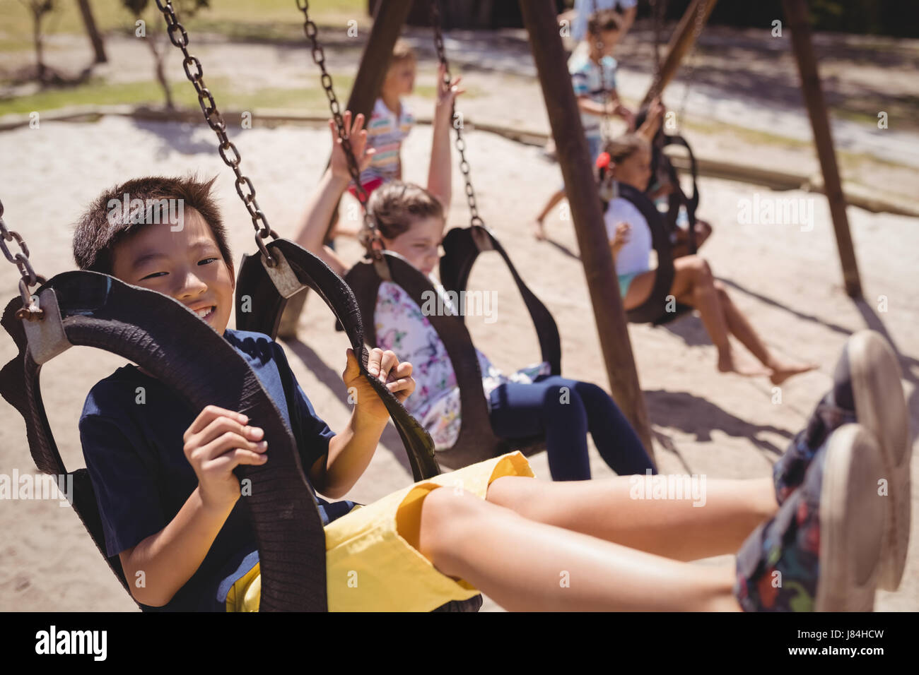 Schoolkids playing in playground of school Stock Photo - Alamy