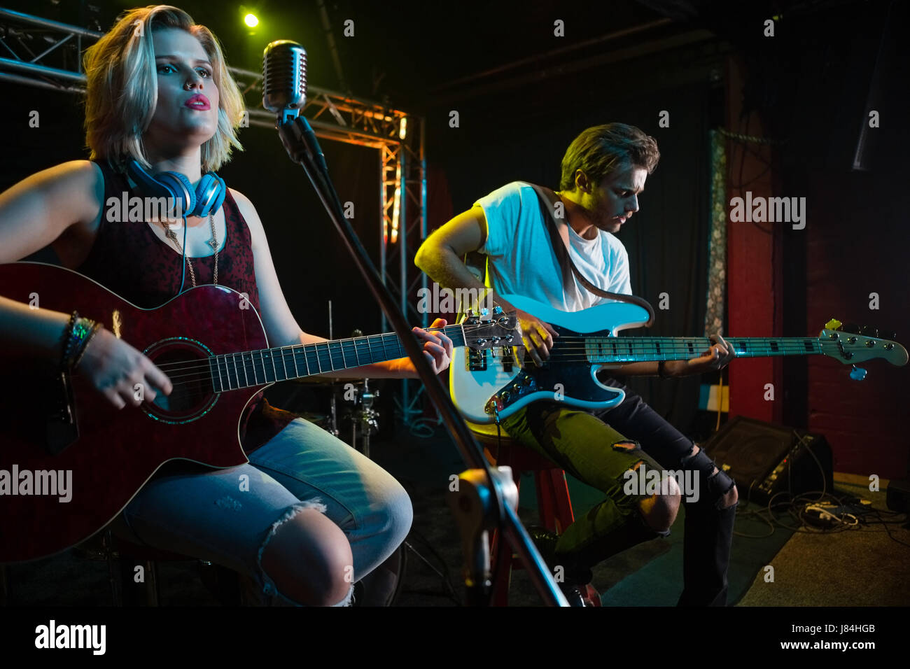 Band performing on stage in nightclub Stock Photo - Alamy
