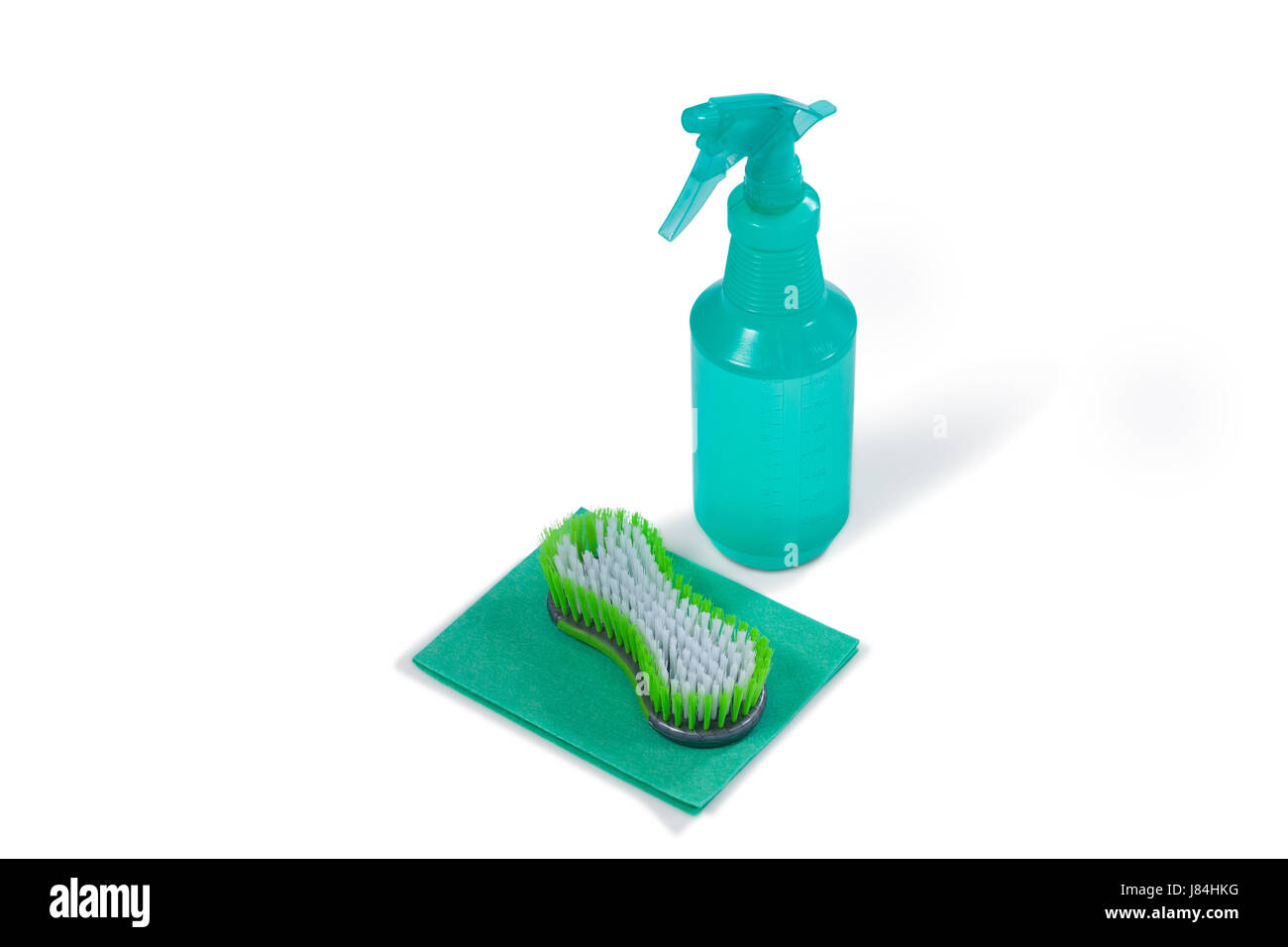 Cleaning spray bottle, sponge and brush on white background Stock Photo ...