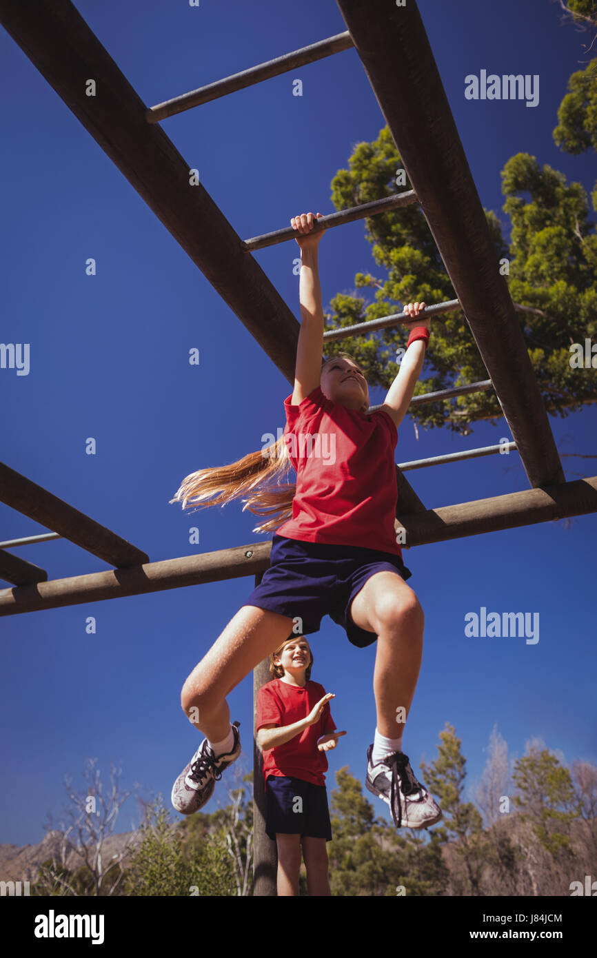 Climbing monkey bars child hi-res stock photography and images - Alamy