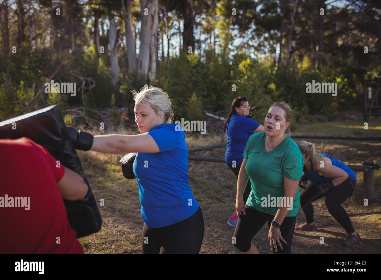 Woman practicing boxing in the boot camp on a sunny day Stock Photo - Alamy