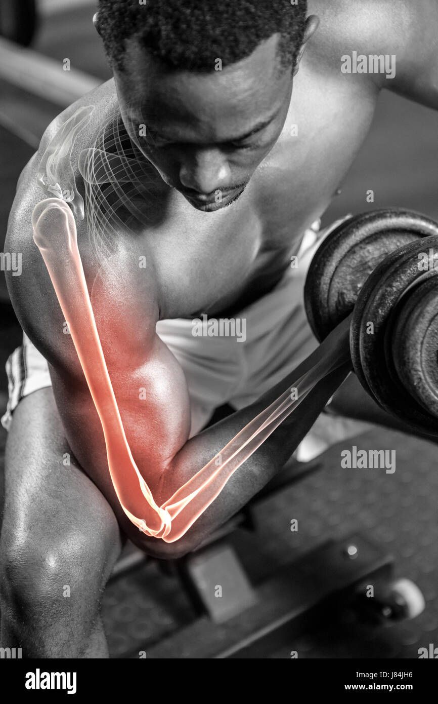 Dedicated shirtless man doing excercise with dumbbells at gym Stock ...
