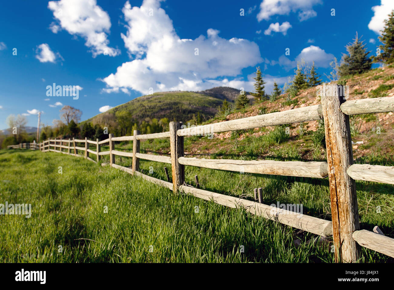 Beautiful colorful landscape with a fence Stock Photo - Alamy