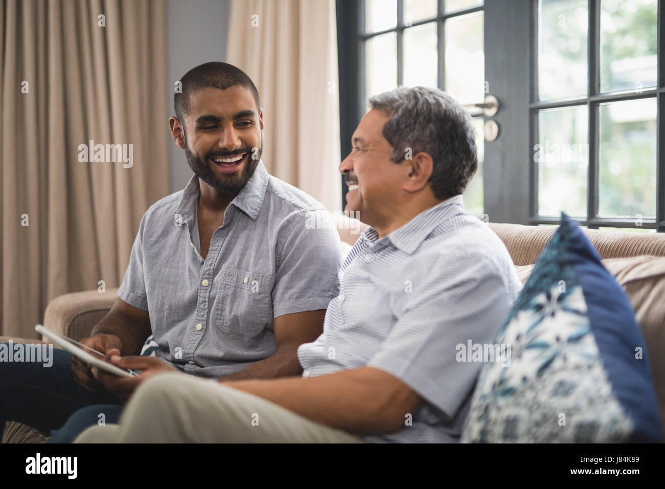 Father son sitting the window home hi-res stock photography and images ...