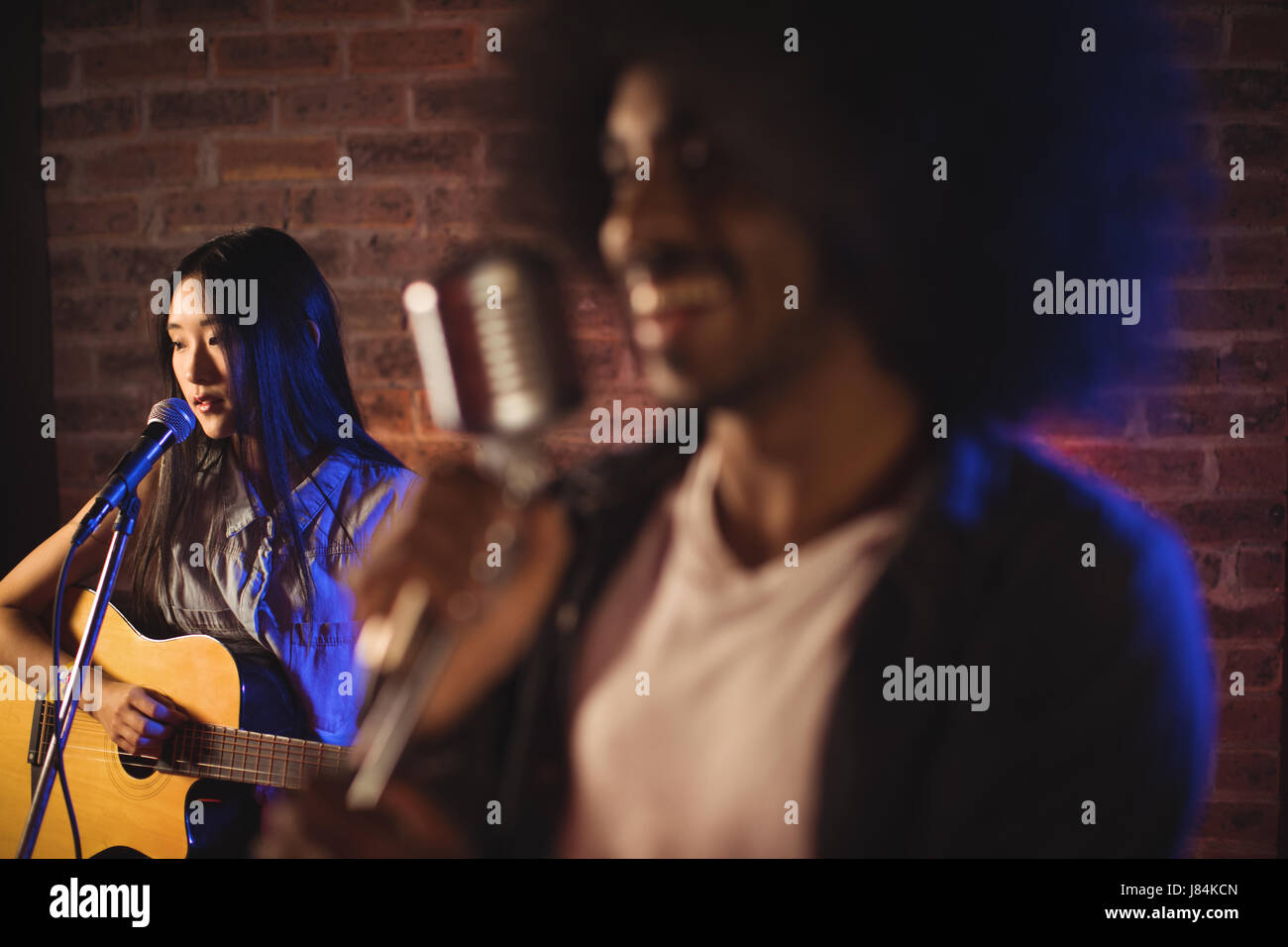 Singer performance standing guitar microphone skill holding hi-res ...