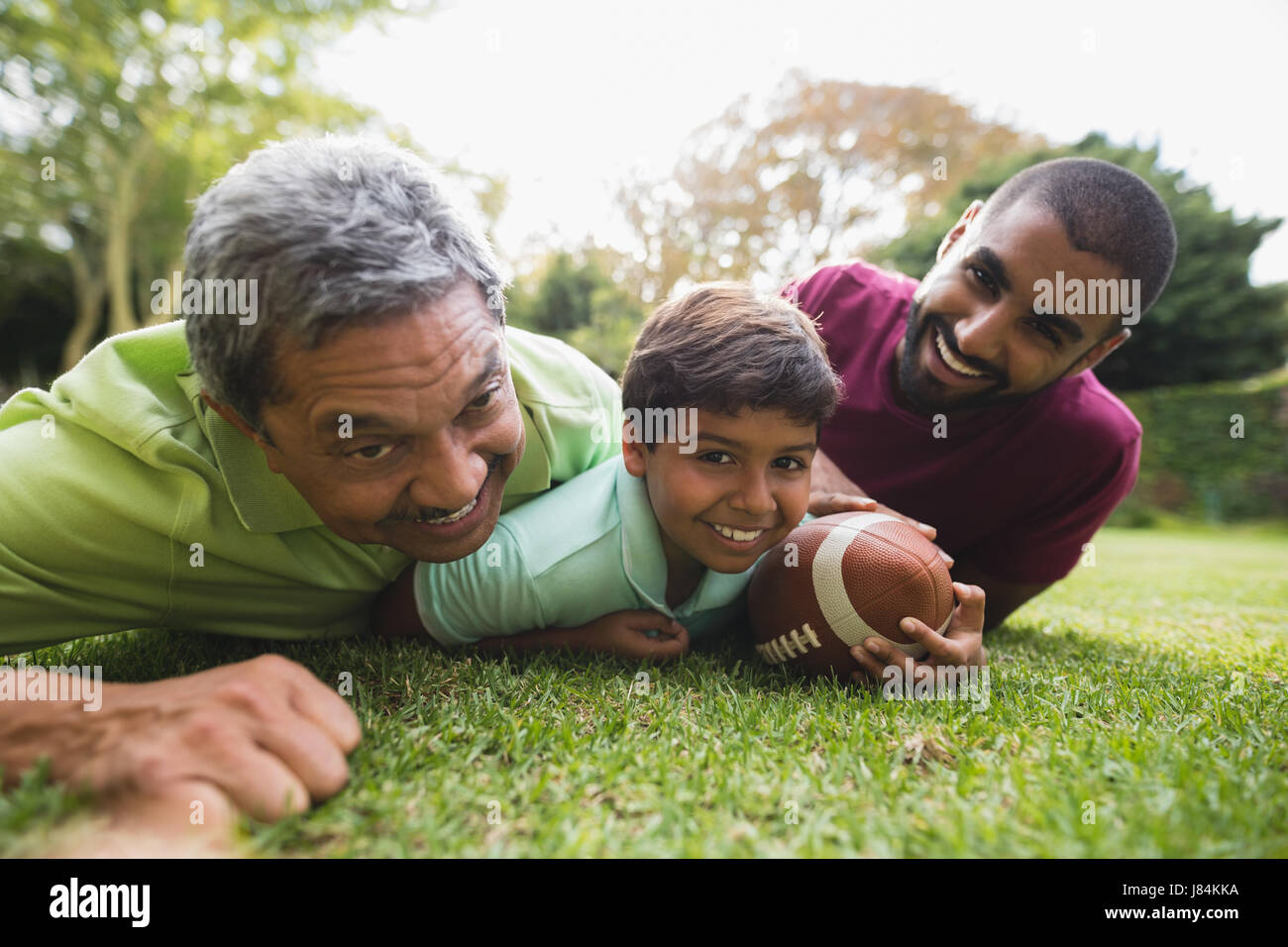 Portrait of multi generation family playing rugby at park Stock Photo ...