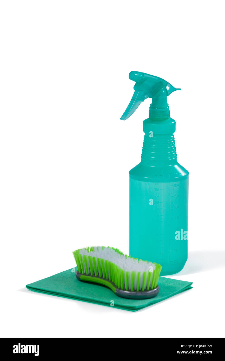 Detergent spray bottle and scouring pad on white background Stock Photo ...