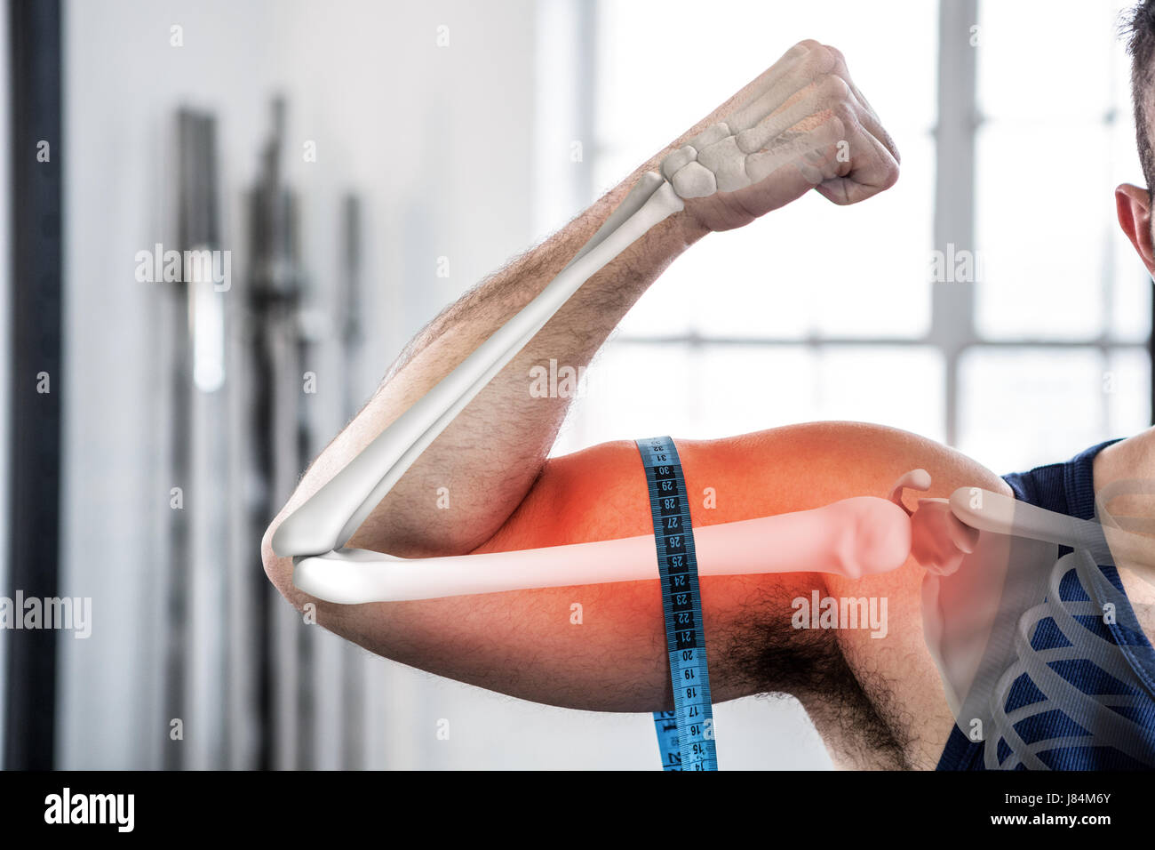 Digital composite of highlighted arm of man measuring biceps with ...