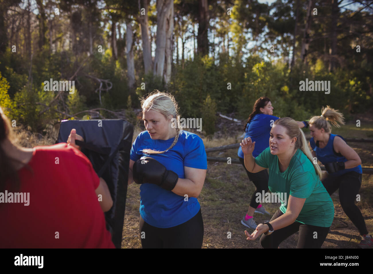 Mature woman with boxing glove hi-res stock photography and images - Alamy