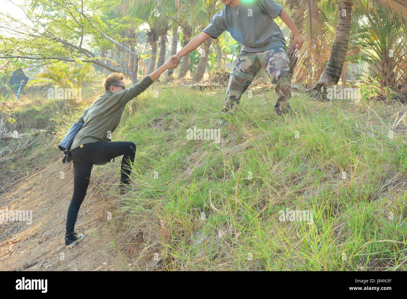 man giving hand for help woman, helping, gentleman Stock Photo - Alamy