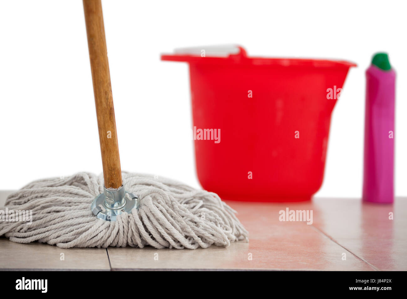 Close-up of mop cleaning the tile floor Stock Photo - Alamy