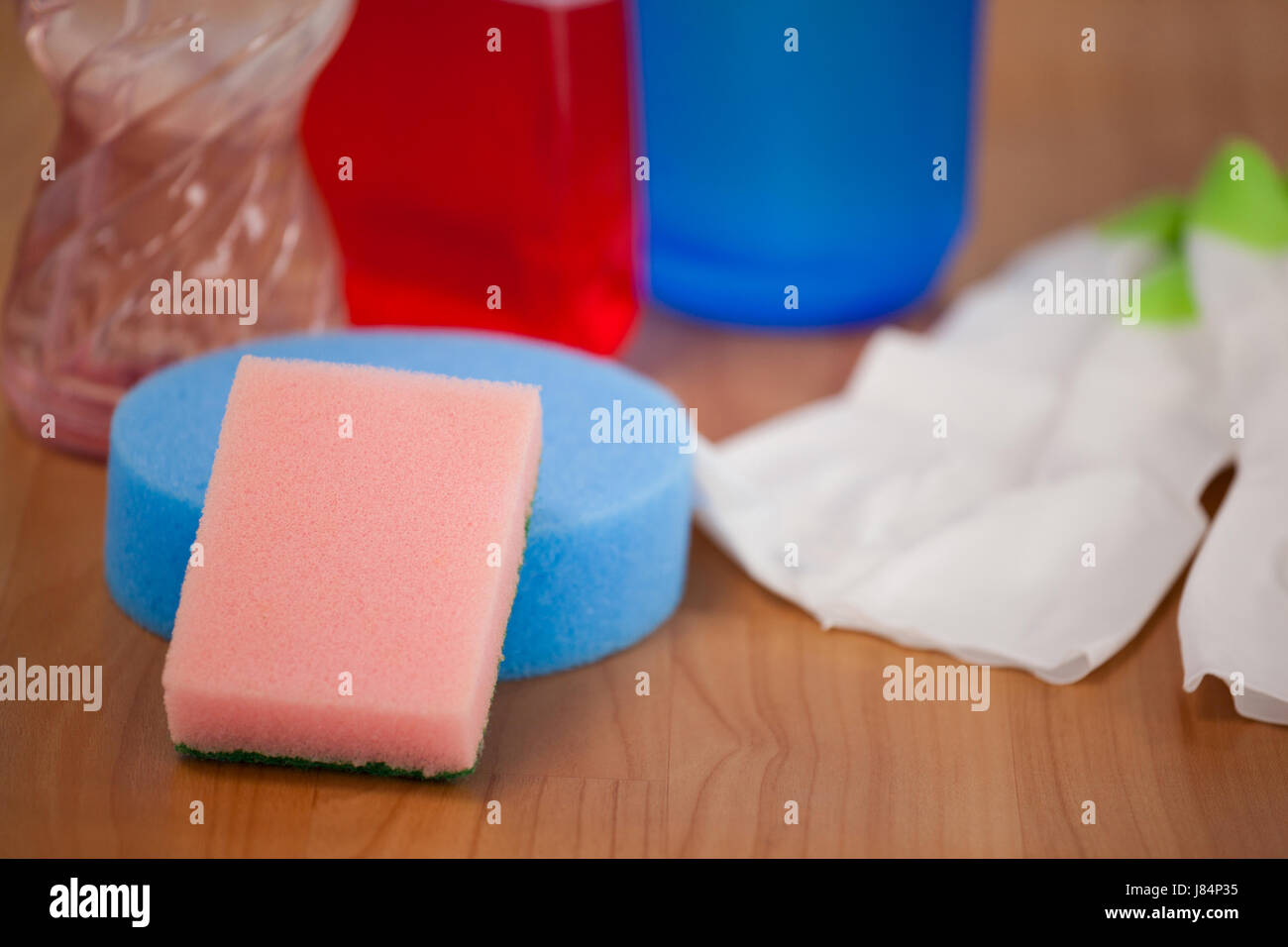 Close-up of various housekeeping supplies on wooden floor Stock Photo ...