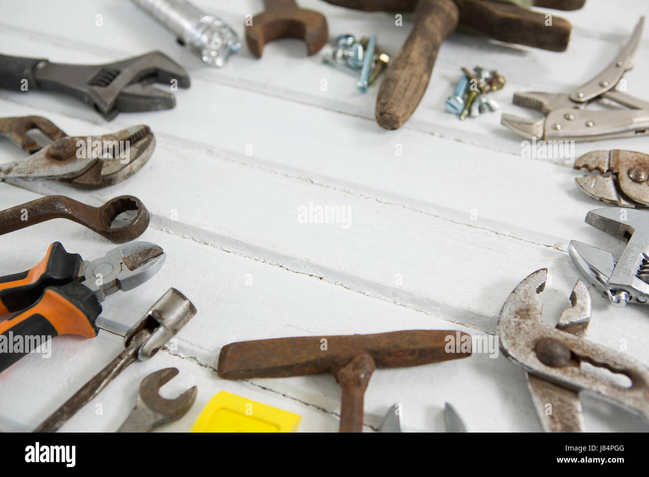 High angle view of hand tools arranged at wooden table Stock Photo - Alamy