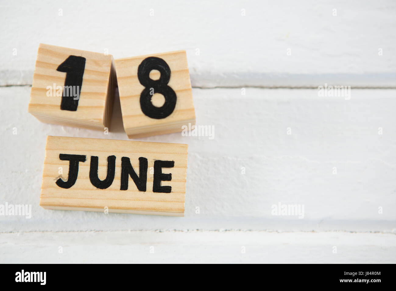 Close up of 18 june text on wooden blocks at table Stock Photo - Alamy