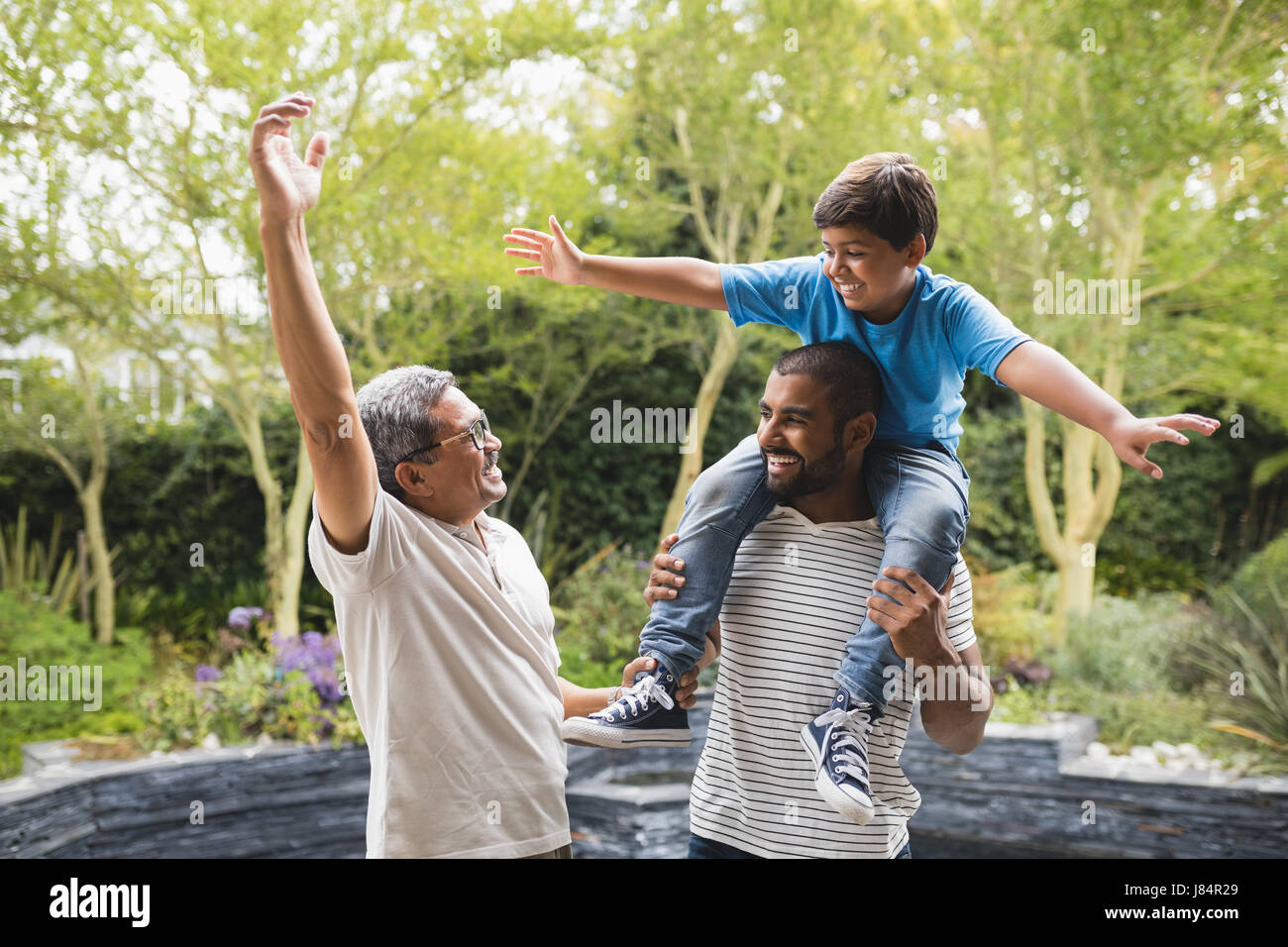 Smiling of happy multi-generation family enjoying together at park ...