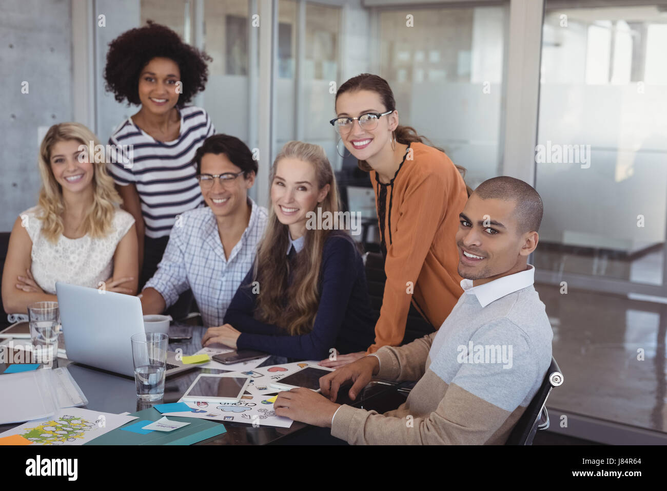 Portrait of smiling colleagues planning in creative office Stock Photo ...