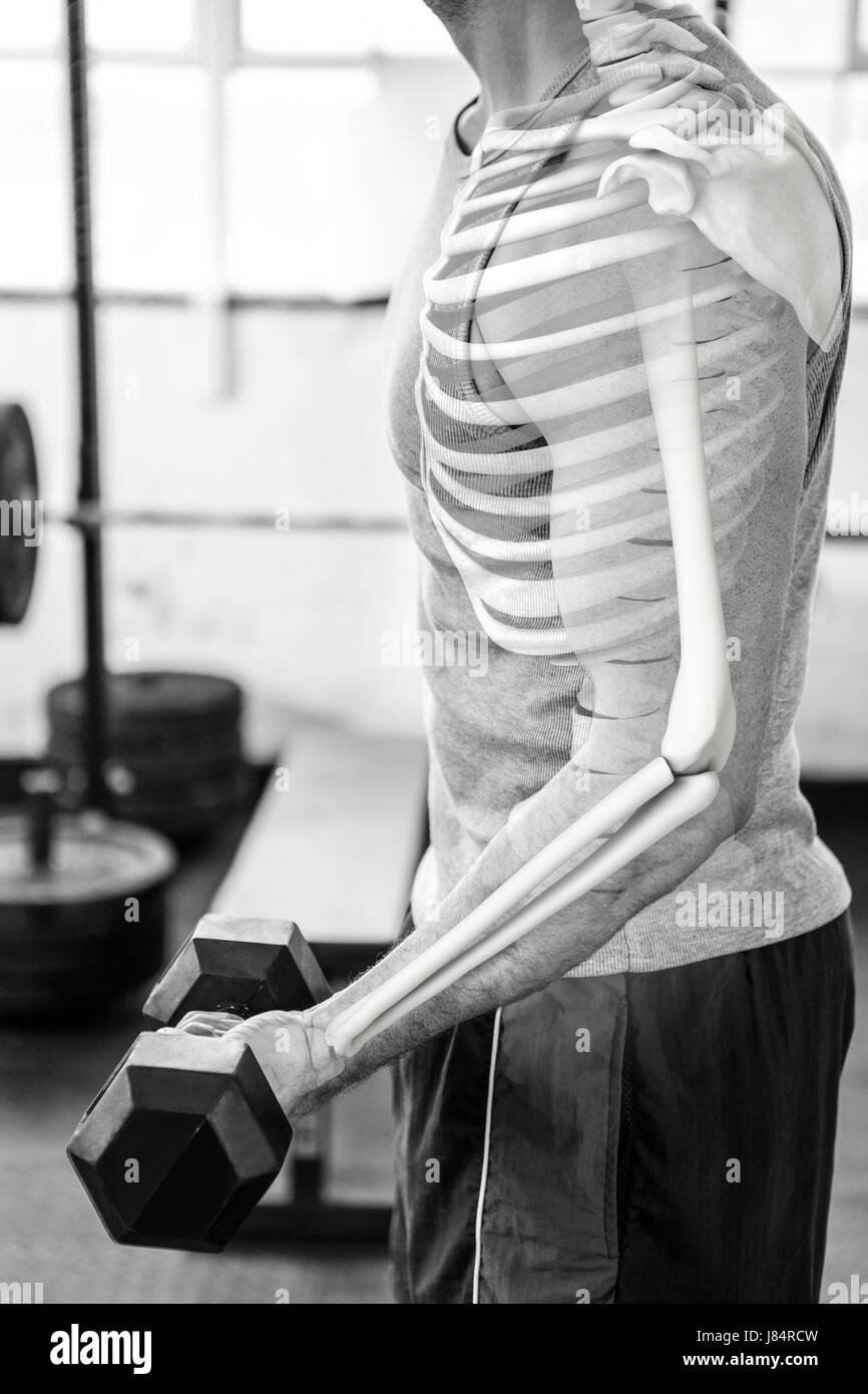 Digital composite of highlighted arm of strong man lifting weights at ...
