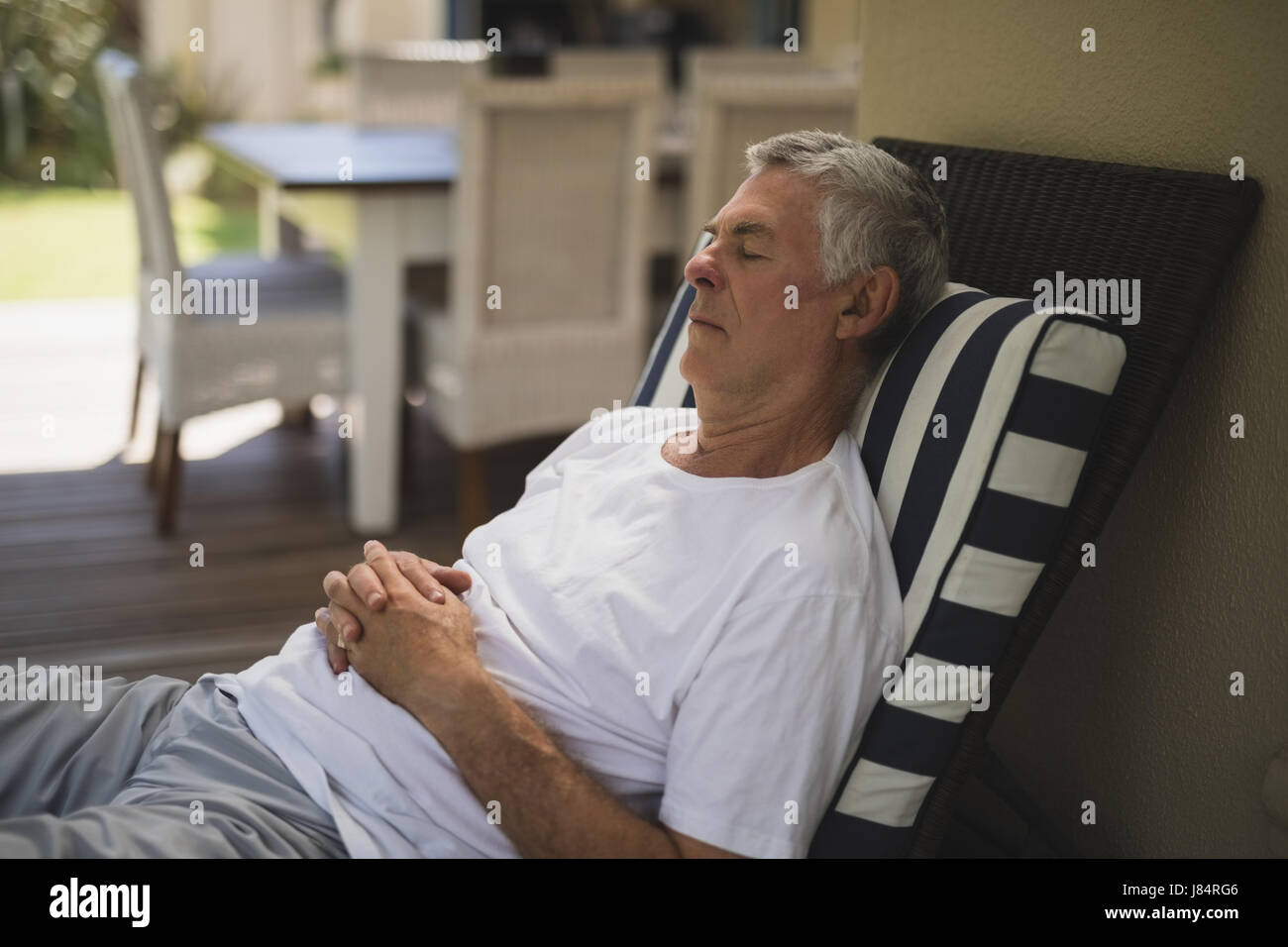 Man Sleeping On Lounge Chair High Resolution Stock Photography and ...