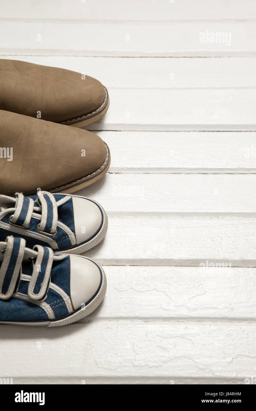 Pairs of new shoes on arranged on wooden plank Stock Photo - Alamy