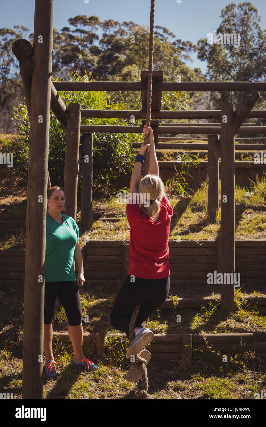Young woman obstacle course climbing hi-res stock photography and ...