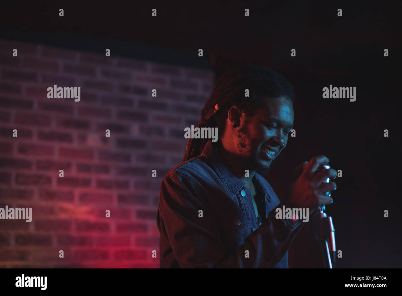 Smiling performing piano guitar hi-res stock photography and images - Alamy