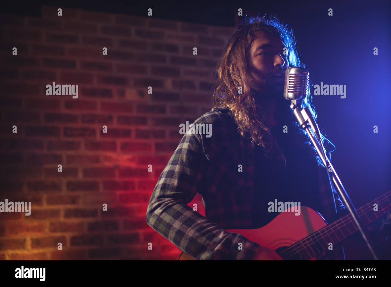 Singer performance standing guitar microphone music skill hi-res stock ...