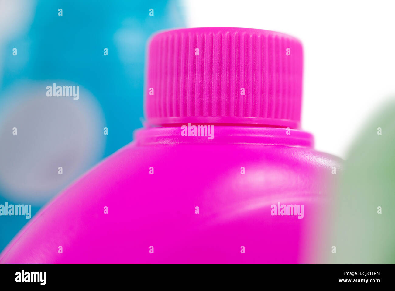 Close-up of pink detergent container on white background Stock Photo ...