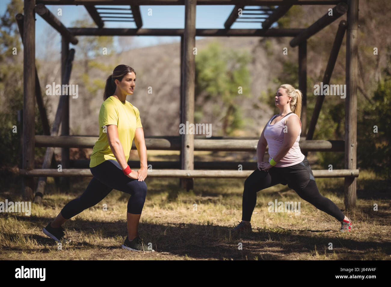 Women exercising during obstacle course in boot camp Stock Photo - Alamy