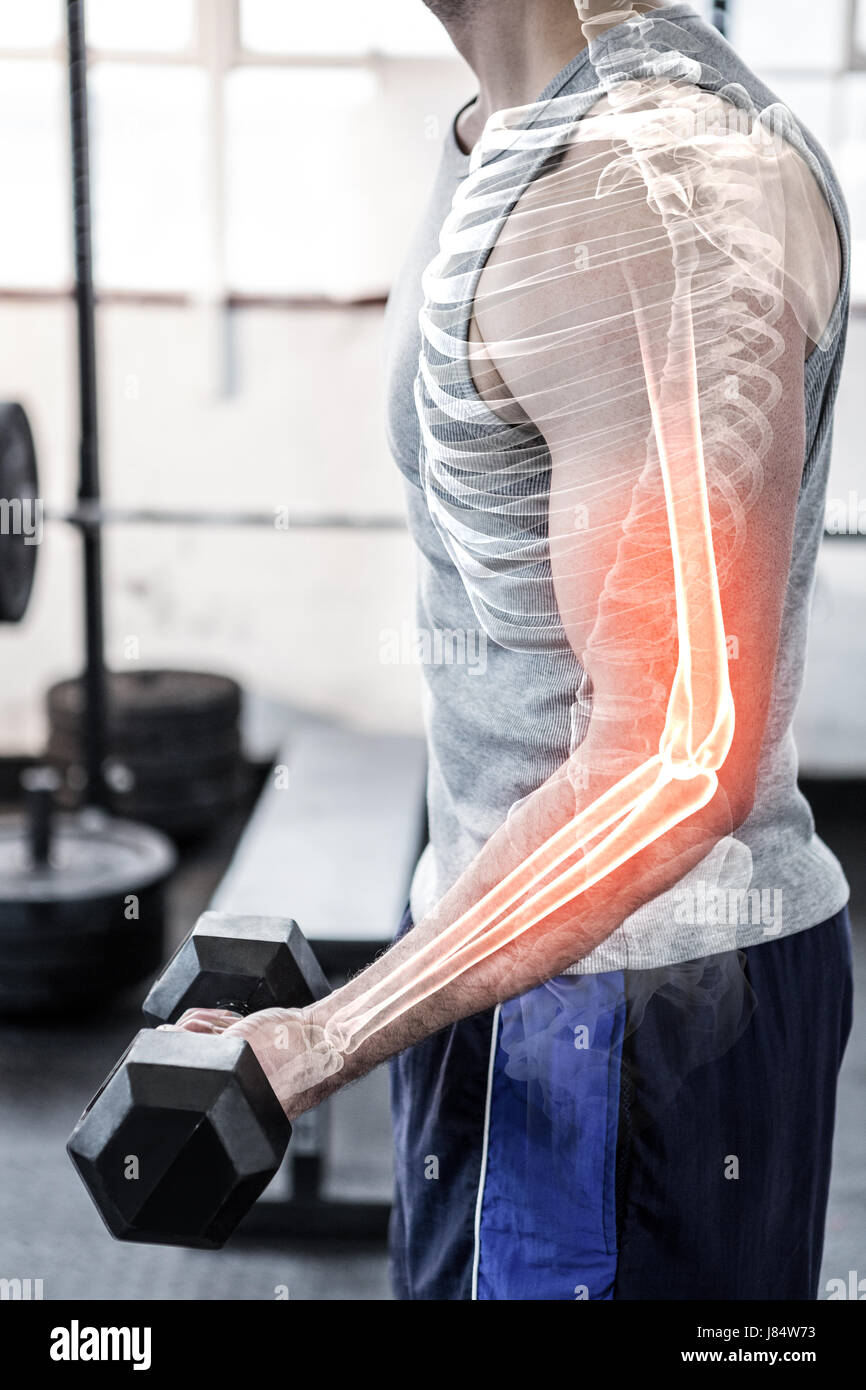 Digital composite of highlighted arm of strong man lifting weights at ...