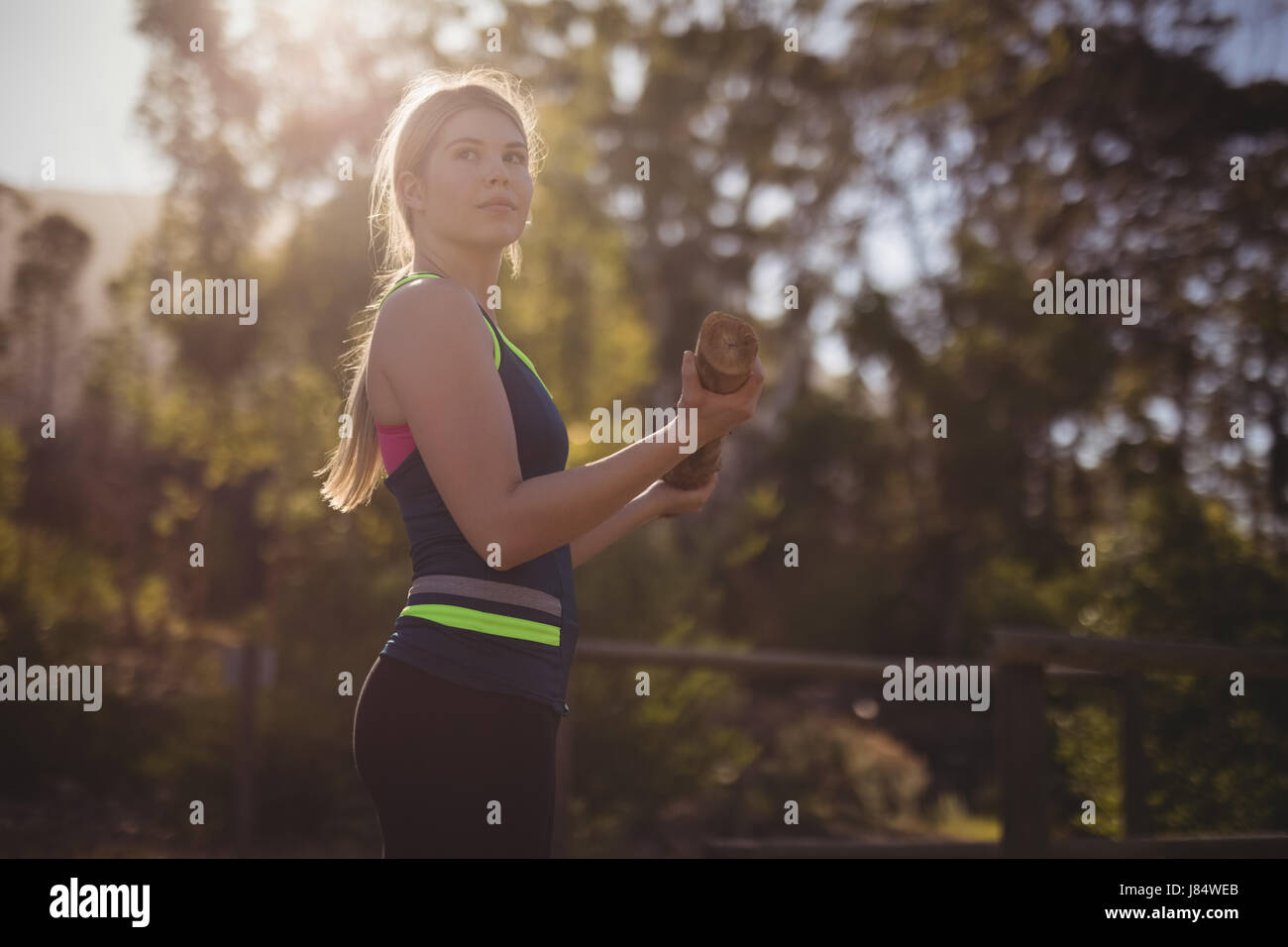 Woman log carrying hi-res stock photography and images - Alamy