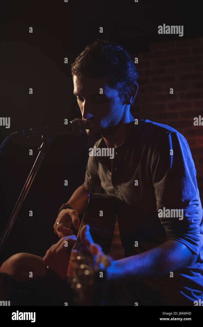 Singer Playing Guitar High Resolution Stock Photography and Images - Alamy