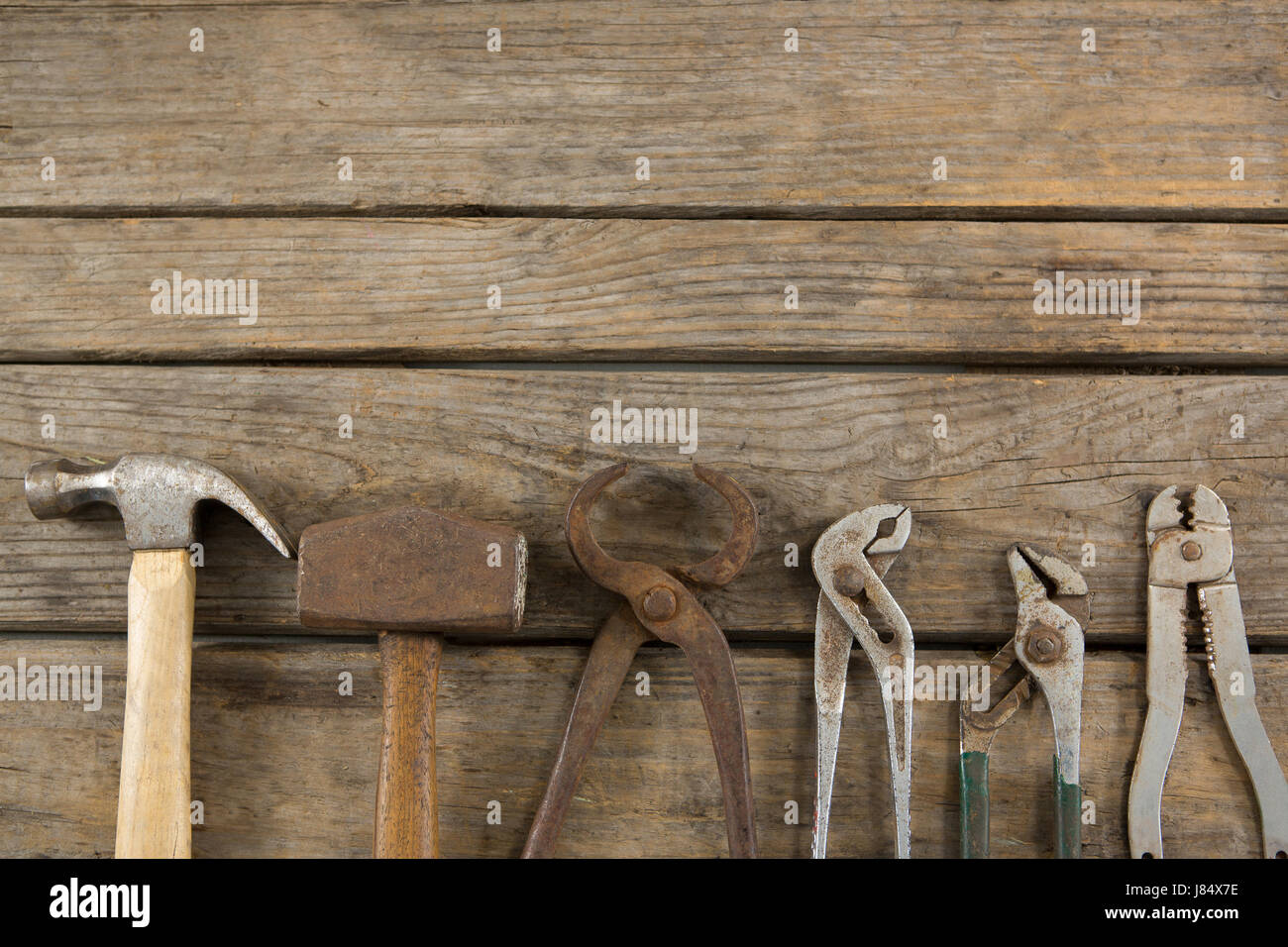 Overhead view of hand tools on wooden table Stock Photo - Alamy