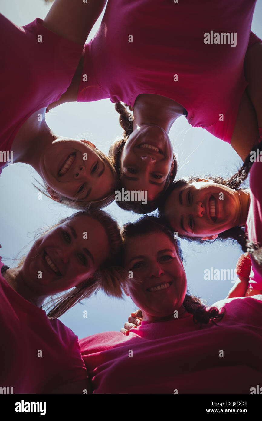 Portrait of womens group forming huddles in the boot camp Stock Photo ...