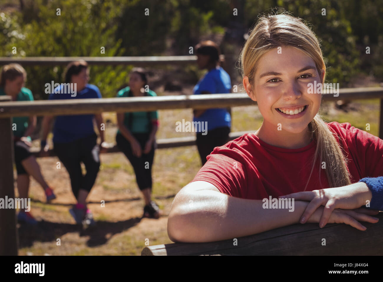 Portrait of fit woman relaxing in the boot camp Stock Photo - Alamy