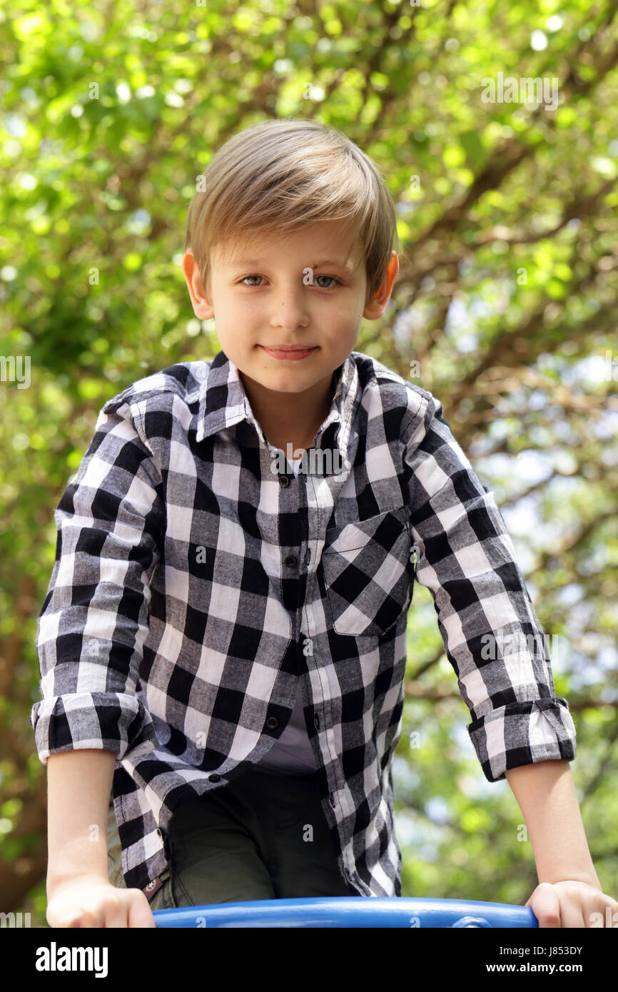 Boy playing in the playground in the park Stock Photo - Alamy