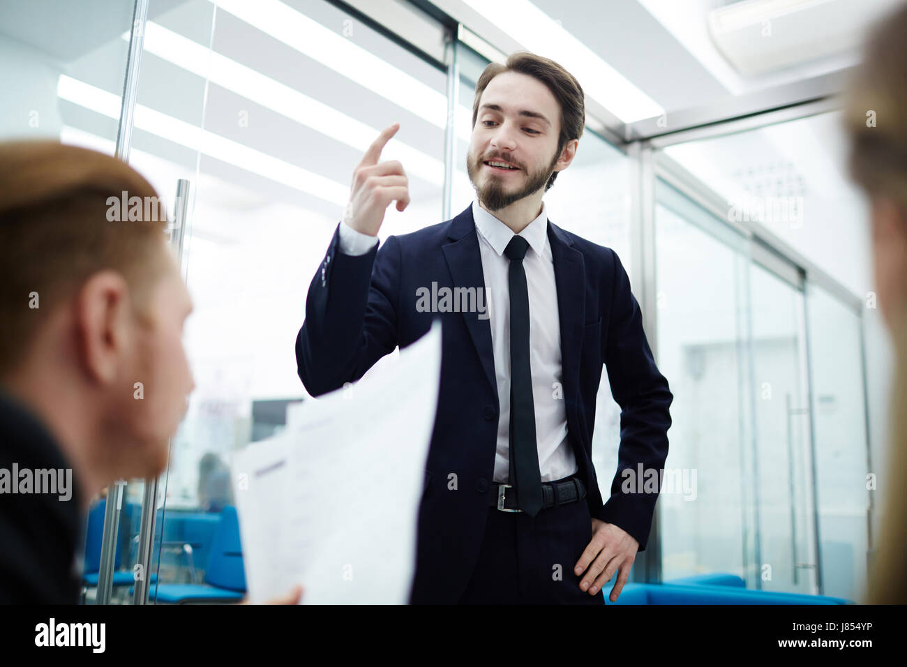 Confident professional explaining principles of leading business Stock ...