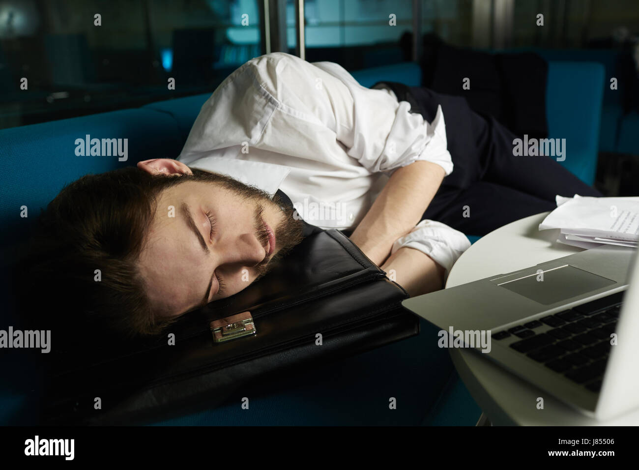 Overworked ceo sleeping by his workplace in office Stock Photo - Alamy