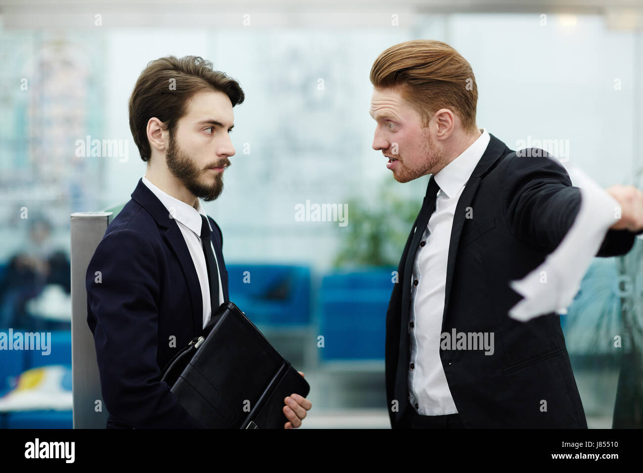 Angry boss shouting at one of employees Stock Photo - Alamy