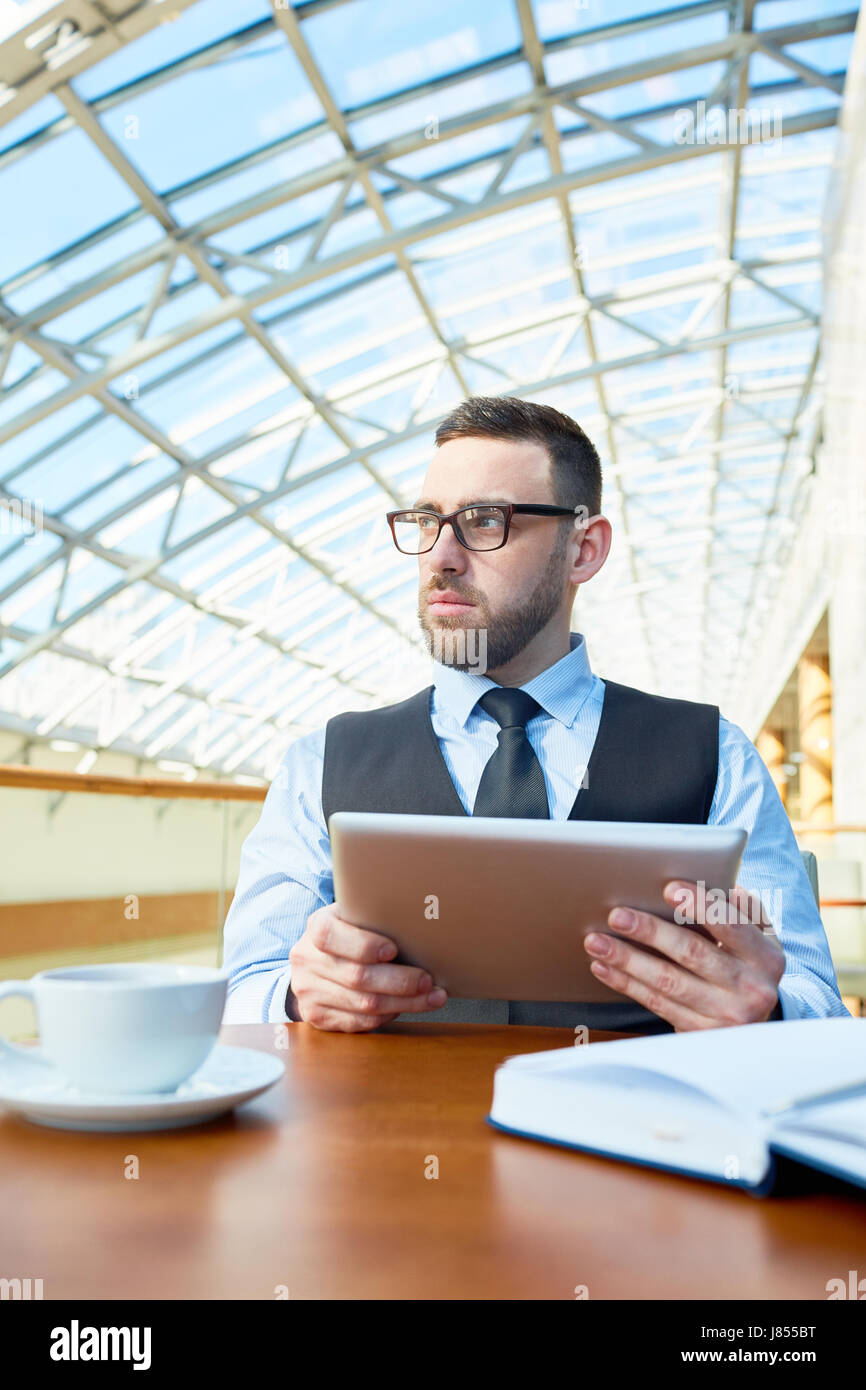 Serious man organizing working day Stock Photo - Alamy