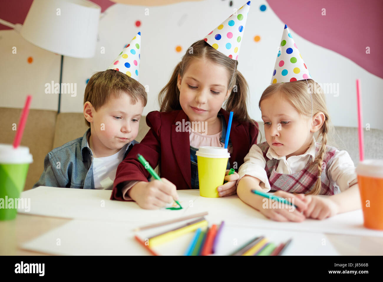 Inspired buddies drawing with highlighters Stock Photo - Alamy