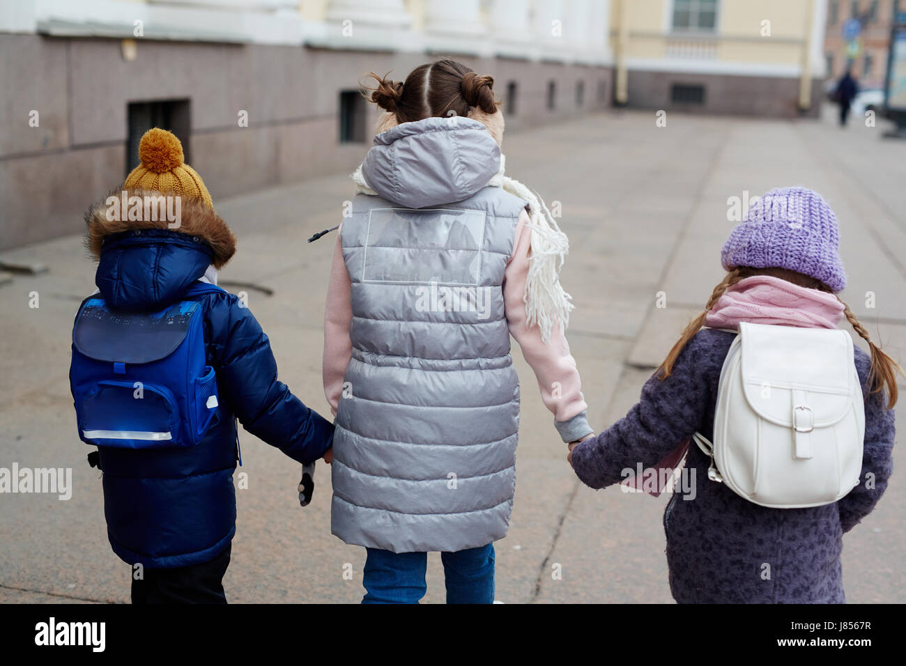 Rear view of three kids going home after walk Stock Photo - Alamy