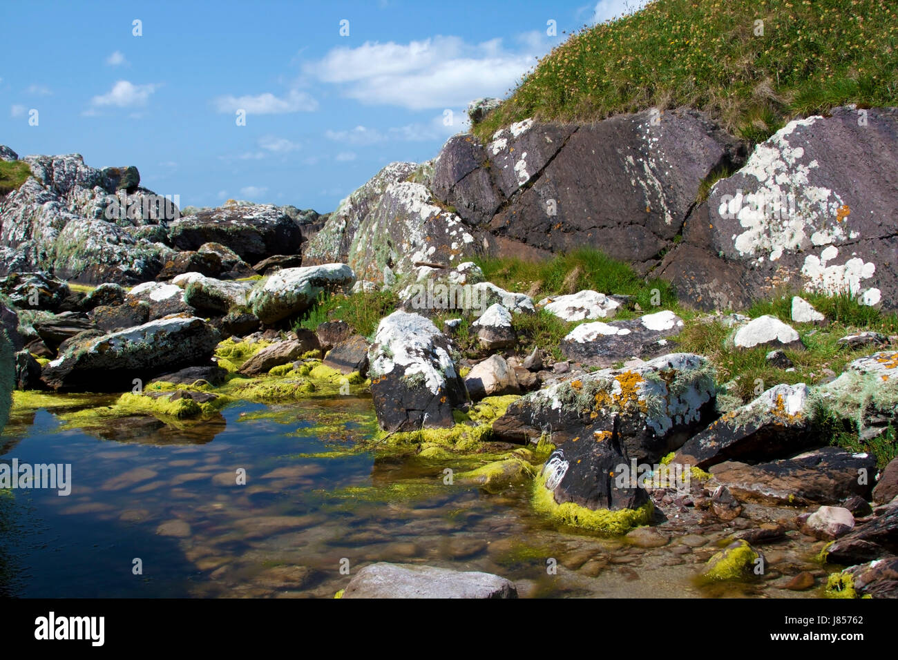 rock moss ireland firmament sky water clouds blue green national park ...