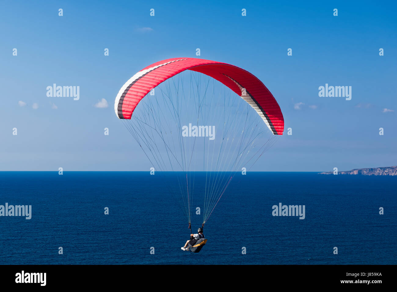 Colorful parachute gliding in sky hi-res stock photography and images ...